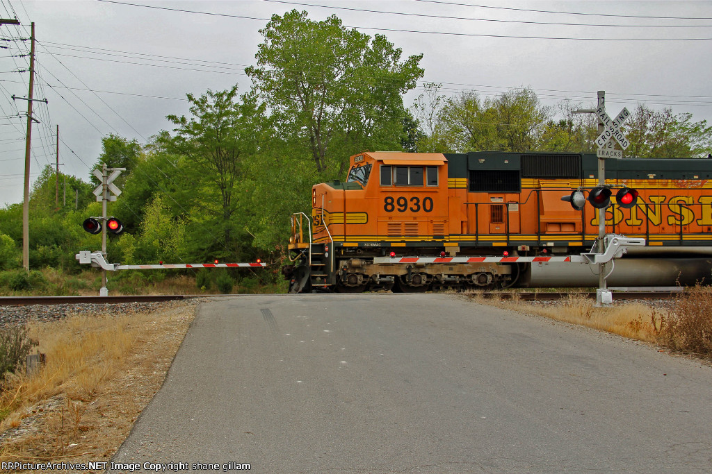 BNSF 8930 rocks this ore train to a stop for a train meet